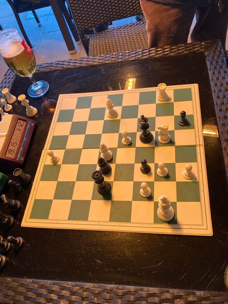 A chess board on a tableDescription automatically generated